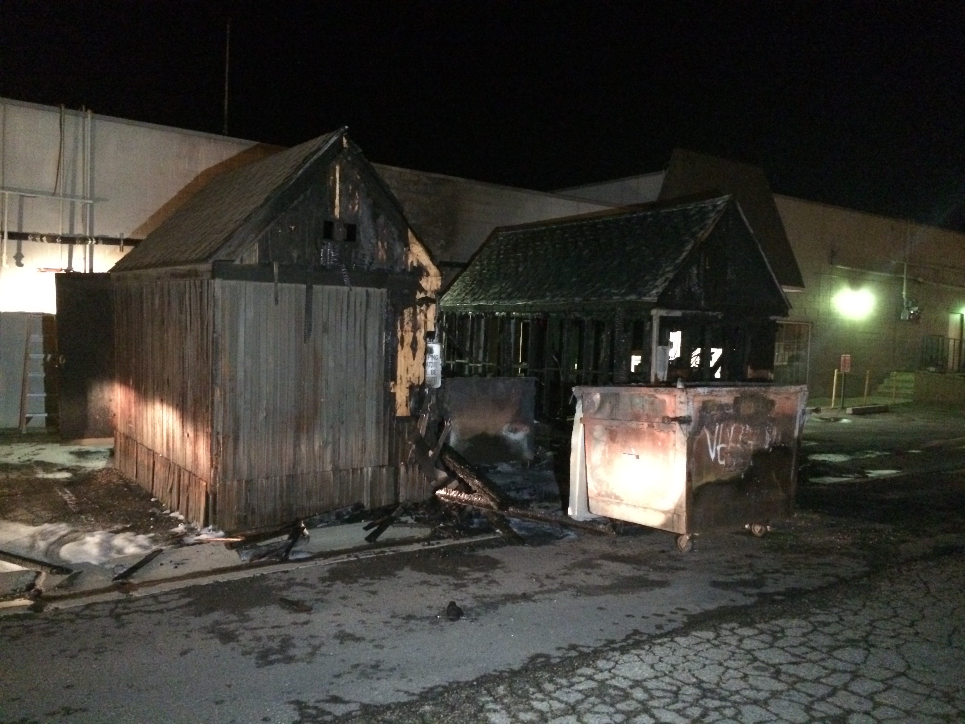 Suspicious fire destroys sheds behind shopping center | 9news.com