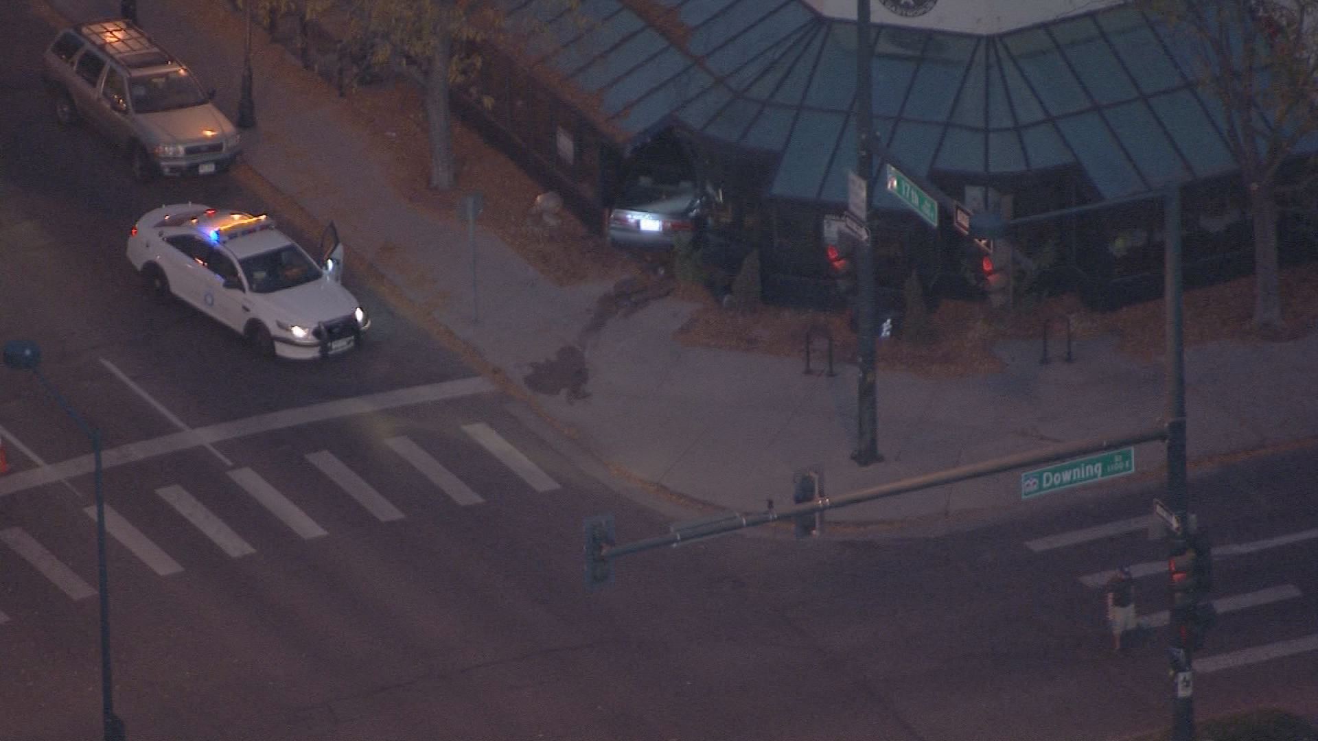 PHOTOS: Car runs into building near 17th and Downing | 9news.com