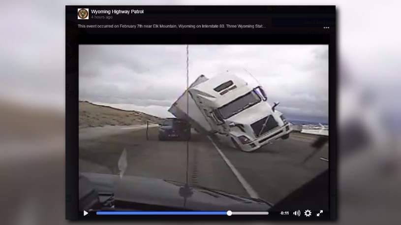 WATCH: Incredible dashcam video shows semi-truck topple onto empty ...