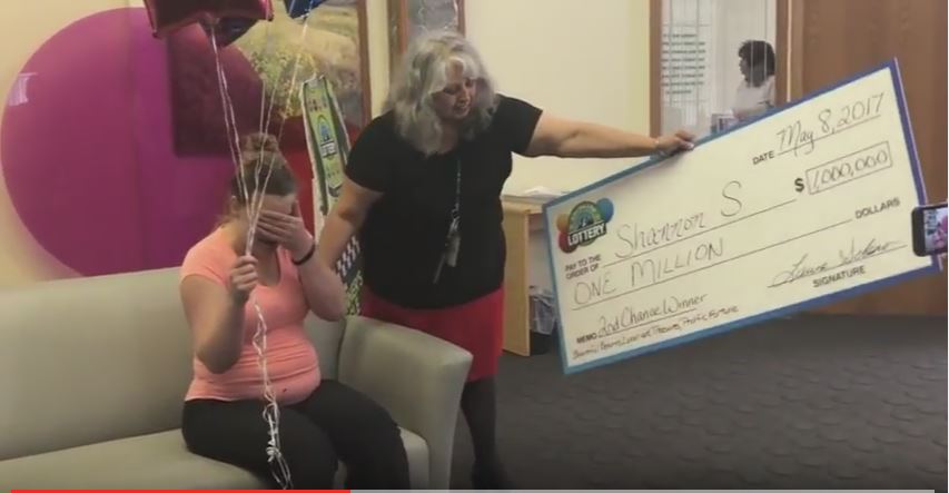 Woman surprised with $1M lotto prize | 9news.com
