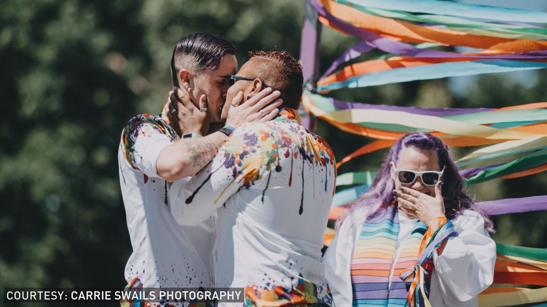 Couple married on a float at Denver's PrideFest | 9news.com